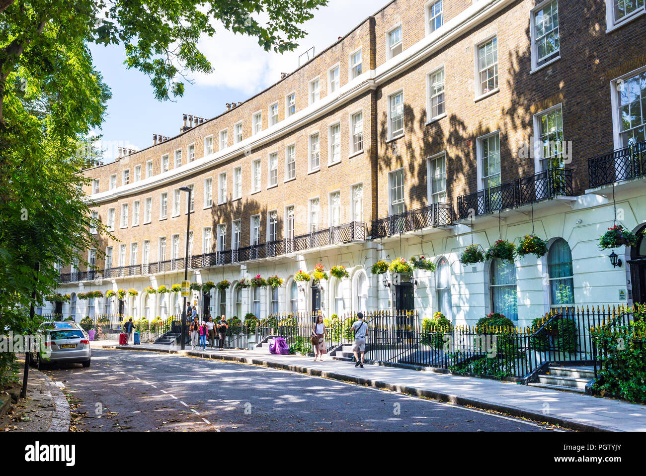 Classic British crescent with Georgian style townhouses in a summer day ...