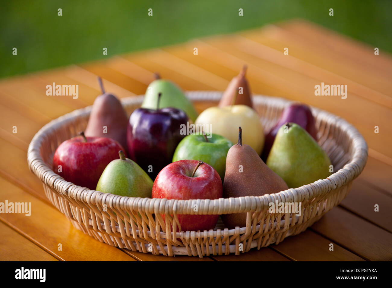 A basket of fruit with apples and pears of different varieties Stock ...