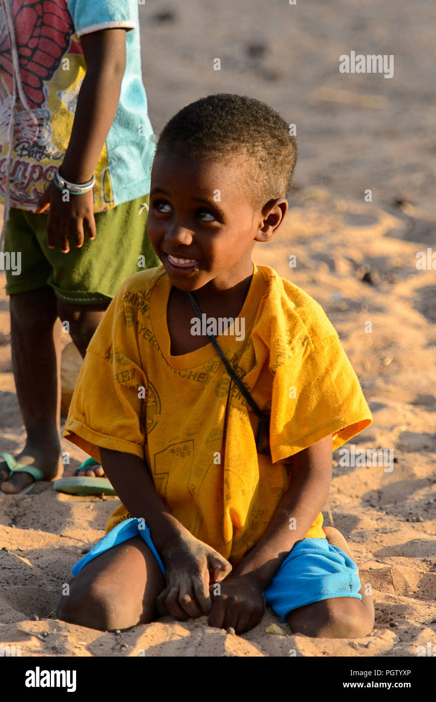 FERLO DESERT, SENEGAL - APR 25, 2017: Unidentified Fulani little boy ...