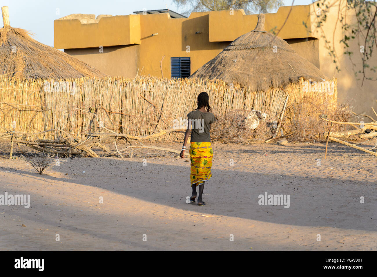 FERLO DESERT, SENEGAL - APR 25, 2017: Unidentified Fulani girl walks ...
