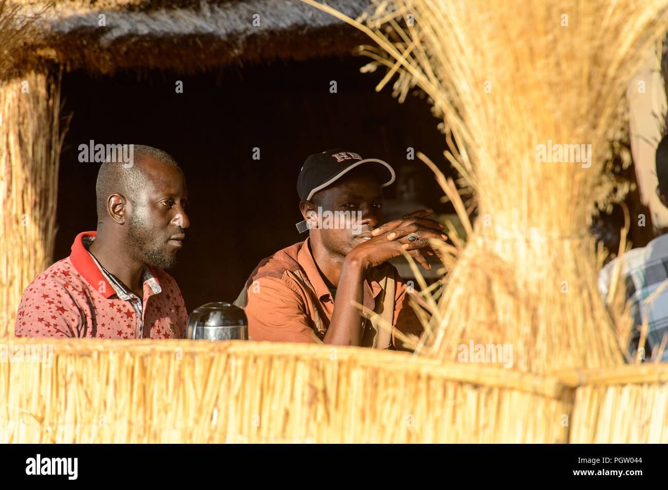 FERLO DESERT, SENEGAL - APR 25, 2017: Unidentified Fulani man sits in ...