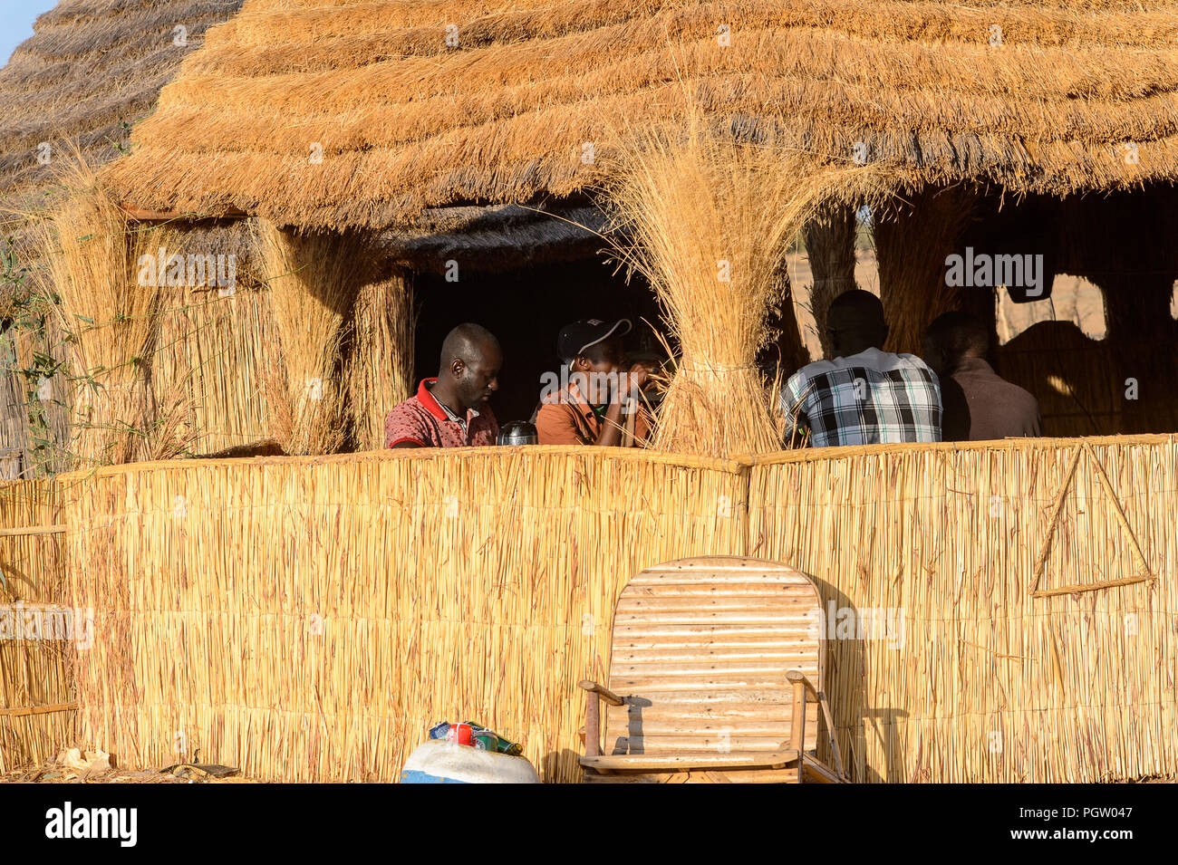 FERLO DESERT, SENEGAL - APR 25, 2017: Unidentified Fulani man sits in ...