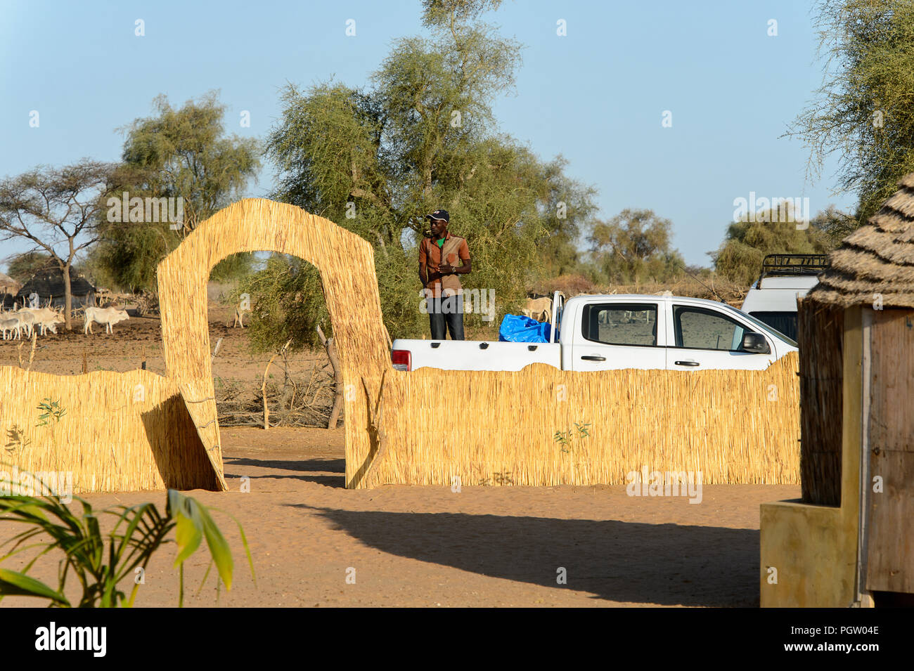 FERLO DESERT, SENEGAL - APR 25, 2017: Unidentified Fulani man stands on ...