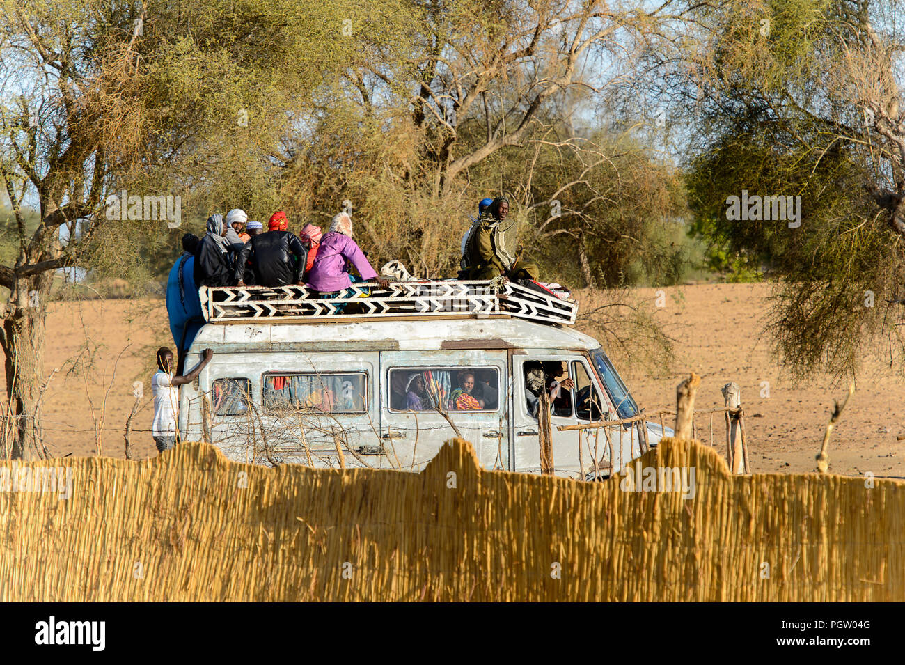 FERLO DESERT, SENEGAL - APR 25, 2017: Unidentified Fulani people ride ...