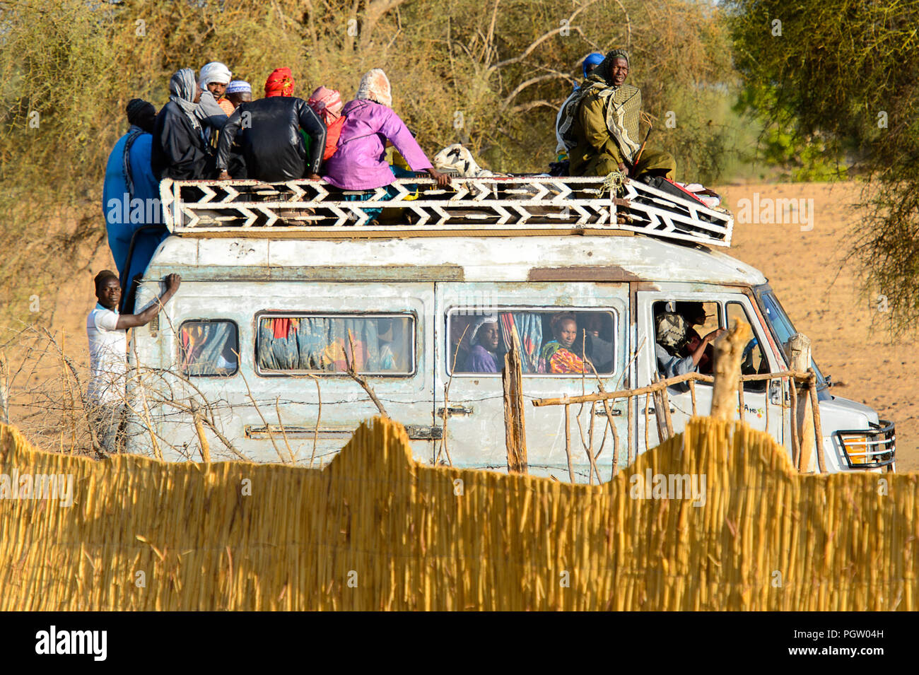 FERLO DESERT, SENEGAL - APR 25, 2017: Unidentified Fulani people ride ...