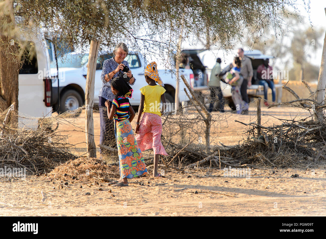 FERLO DESERT, SENEGAL - APR 25, 2017: Unidentified Fulani girls talk ...