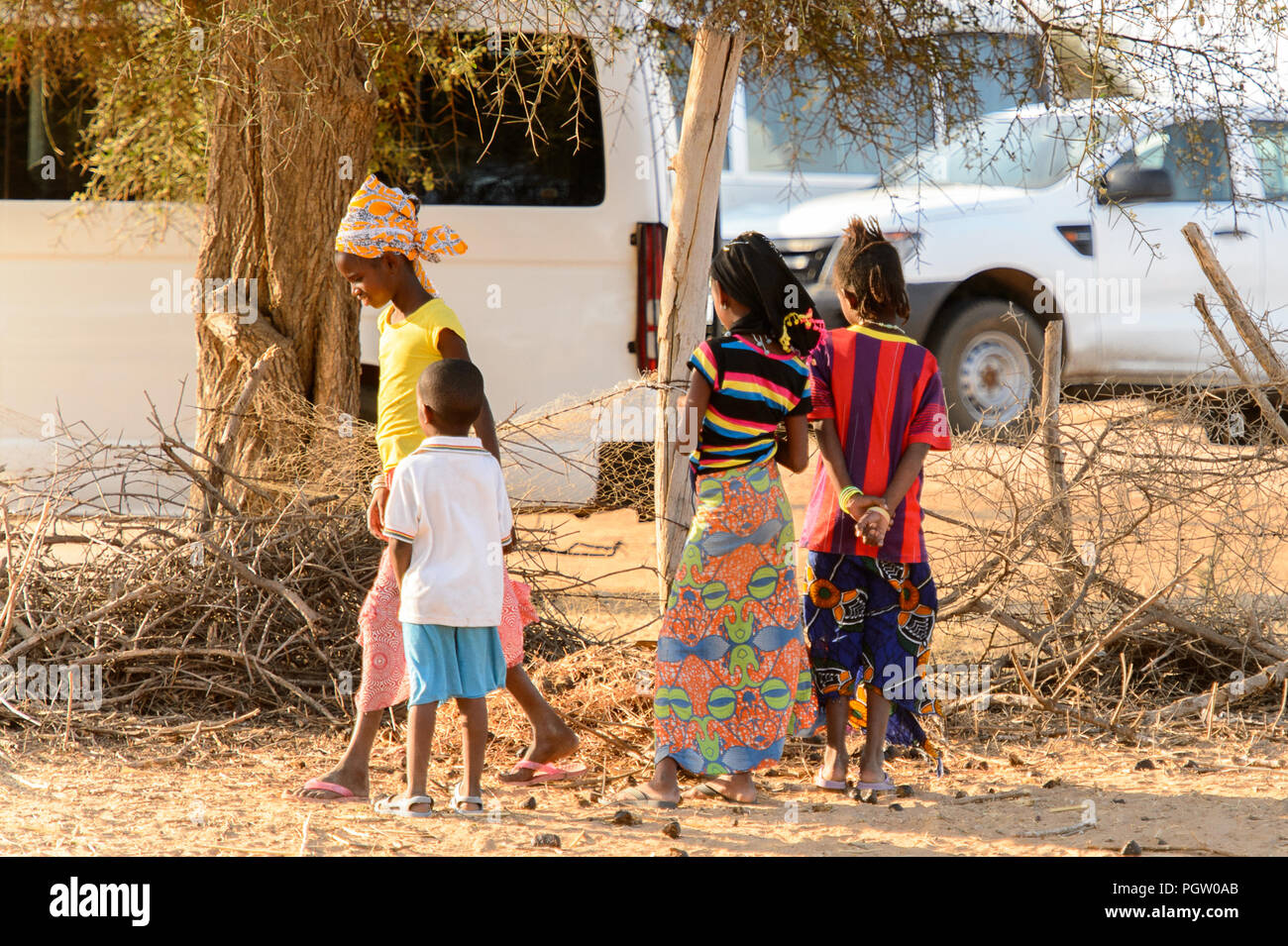FERLO DESERT, SENEGAL - APR 25, 2017: Unidentified Fulani people walk ...