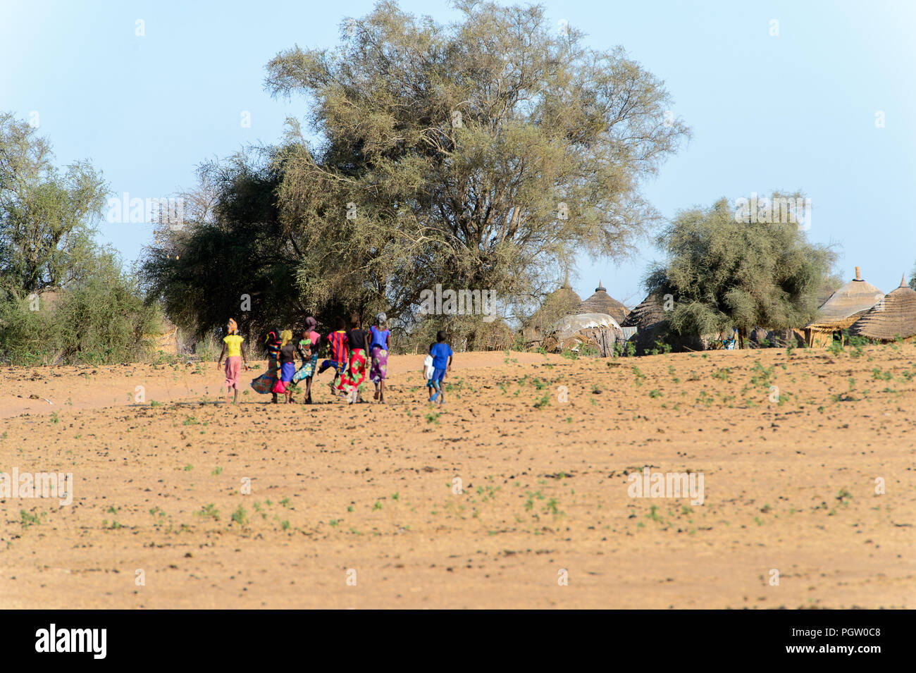 FERLO DESERT, SENEGAL - APR 25, 2017: Unidentified Fulani people walk ...