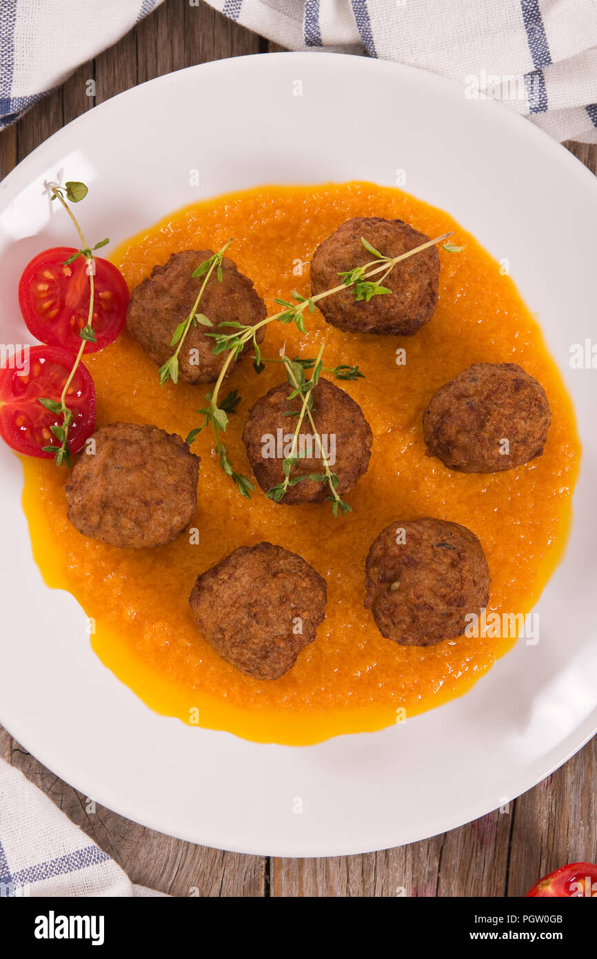 Meatballs with carrot purée Stock Photo - Alamy