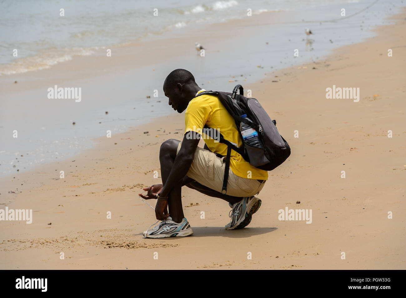 RUBANE, GUINEA BISSAU - MAY 4, 2017: Unidentified local man in yellow ...