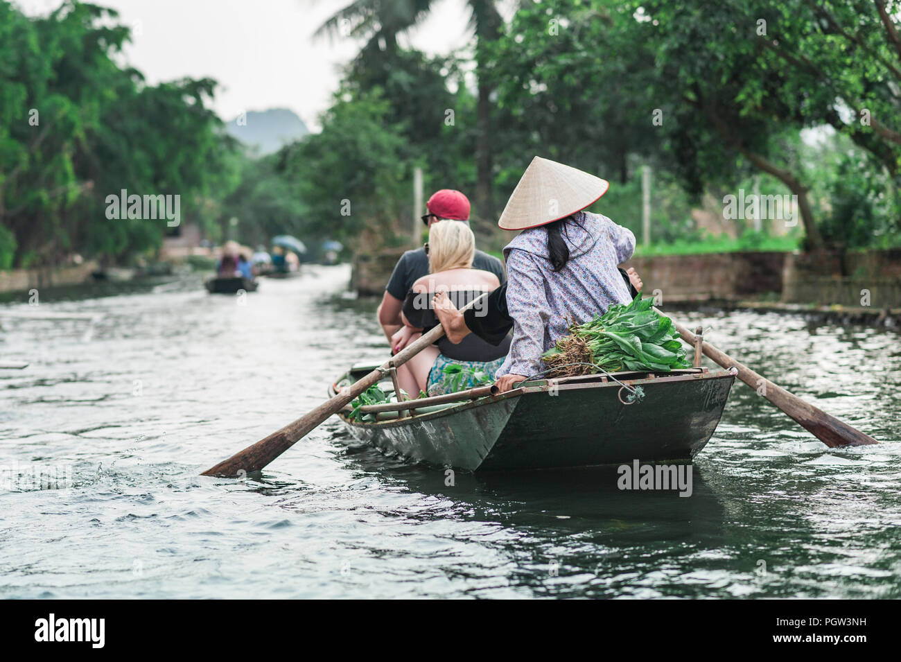 Boat ride from Vung Tram Pier. Traditional paddle-boat trip lets the ...