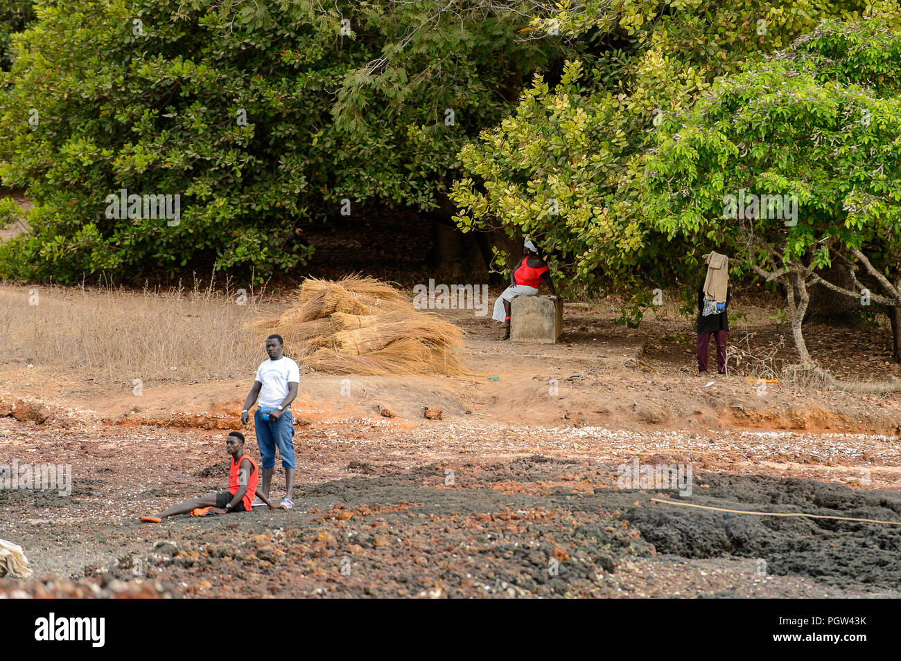 SOGA, GUINEA BISSAU - MAY 5, 2017: Unidentified local people rest on ...