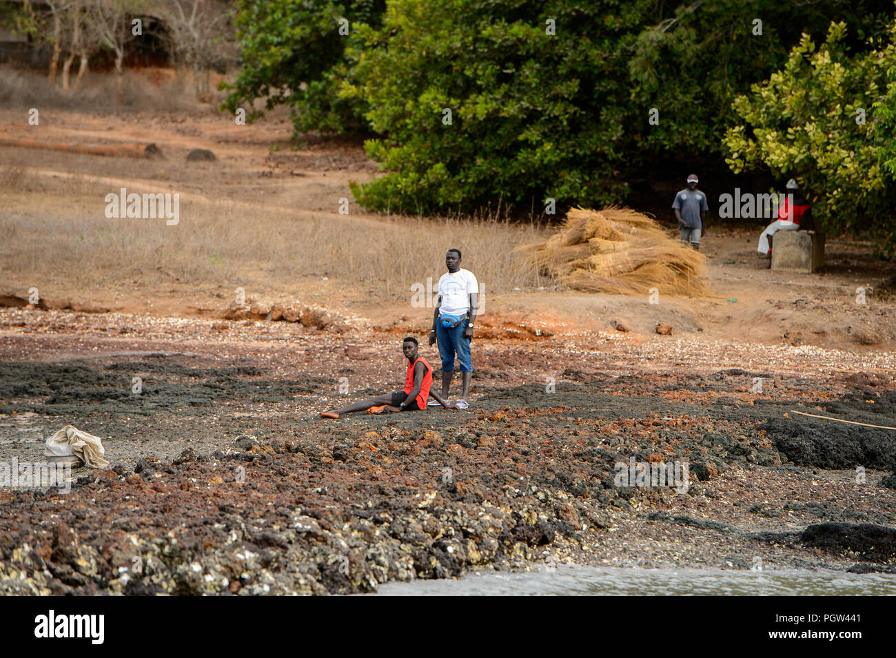 SOGA, GUINEA BISSAU - MAY 5, 2017: Unidentified local people rest on ...