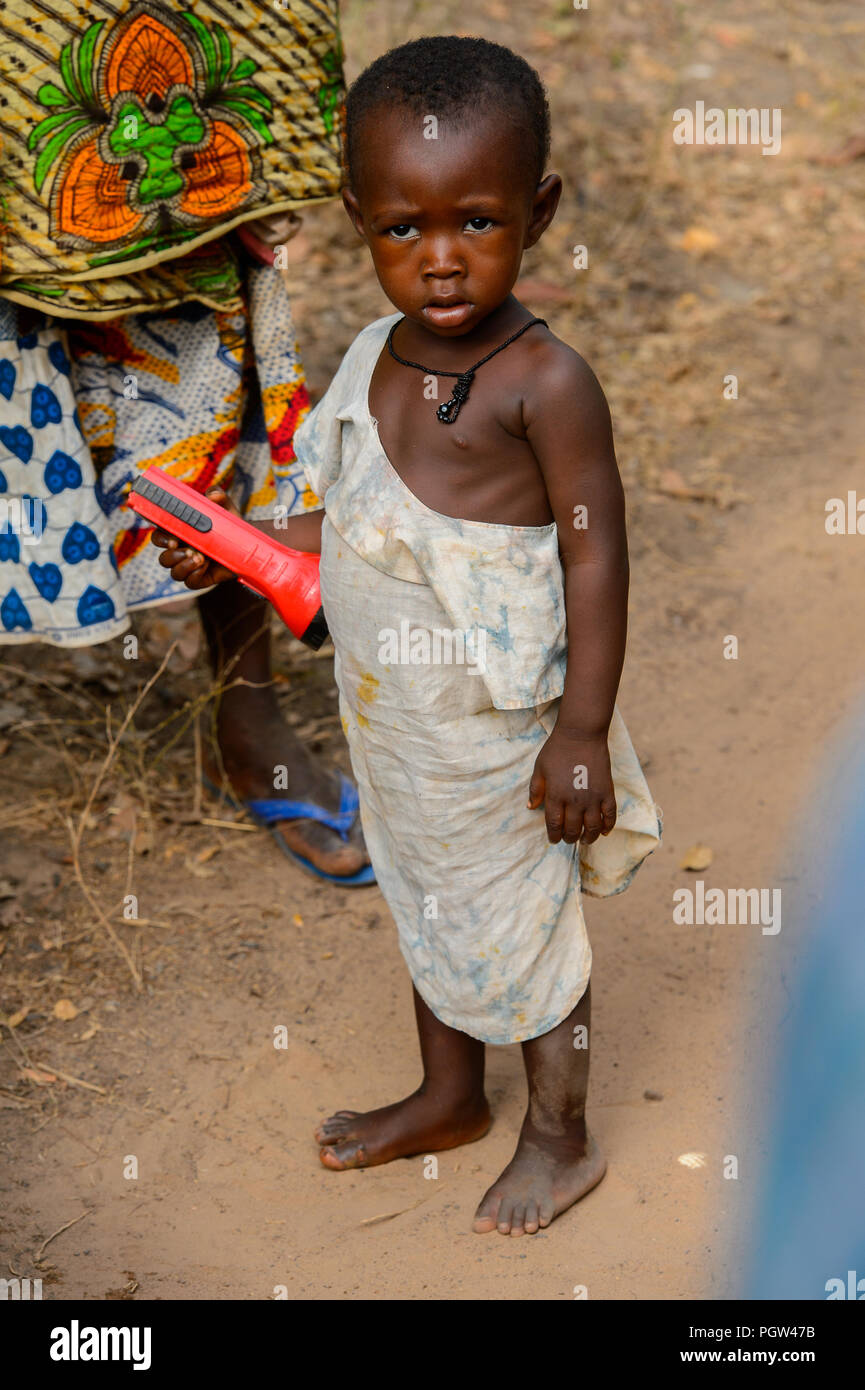 SOGA, GUINEA BISSAU - MAY 5, 2017: Unidentified local little boy looks ...