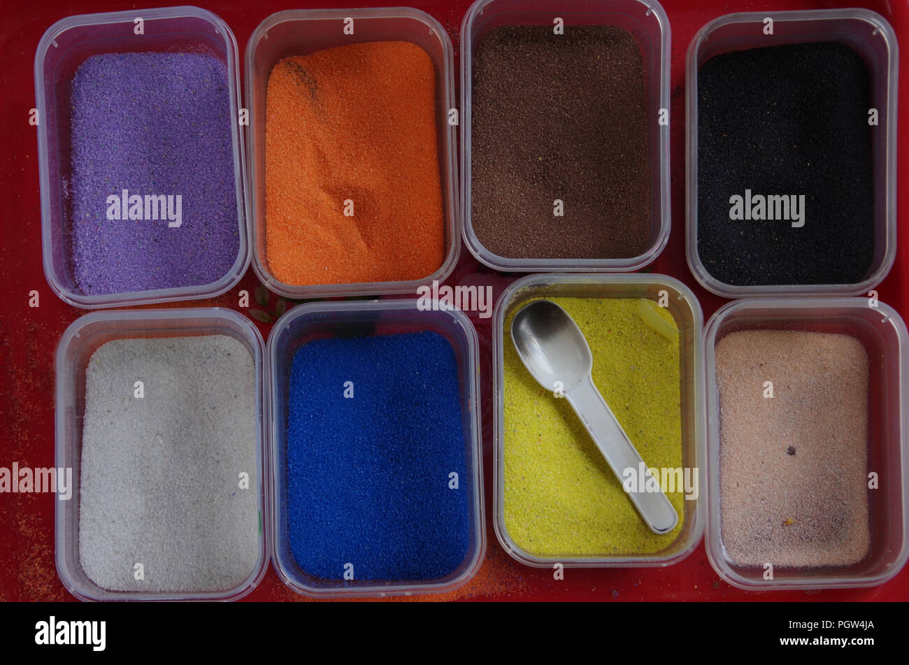 Colorful sand powder and plastic fish background used to draw, toys for ...