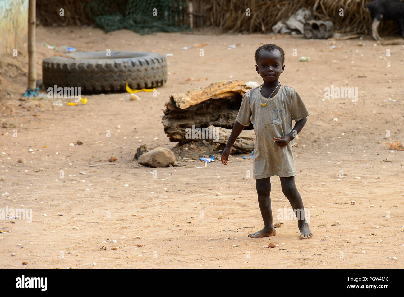 SOGA, GUINEA BISSAU - MAY 5, 2017: Unidentified local little boy stands ...