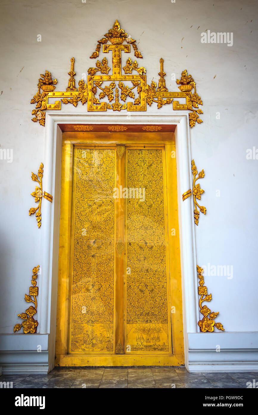 Beautiful golden double doors with white plastered wall background in ...