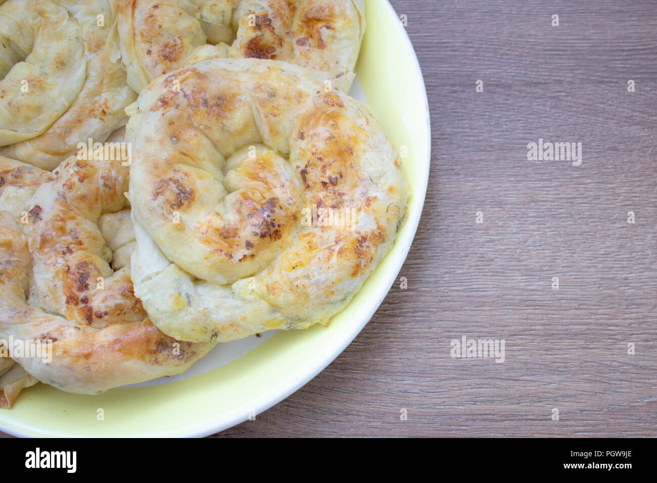 Baked snack with stuffing with golden crust. Traditional moldavian food ...