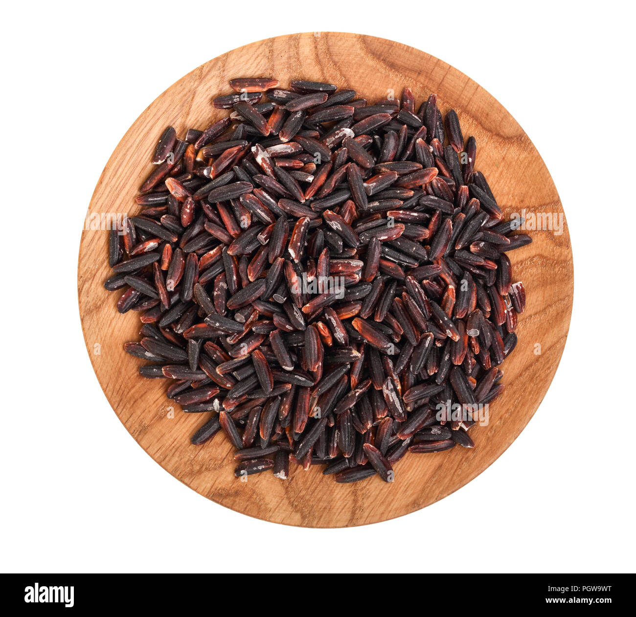 black rice grains in wooden bowl isolated on white background. Top view ...