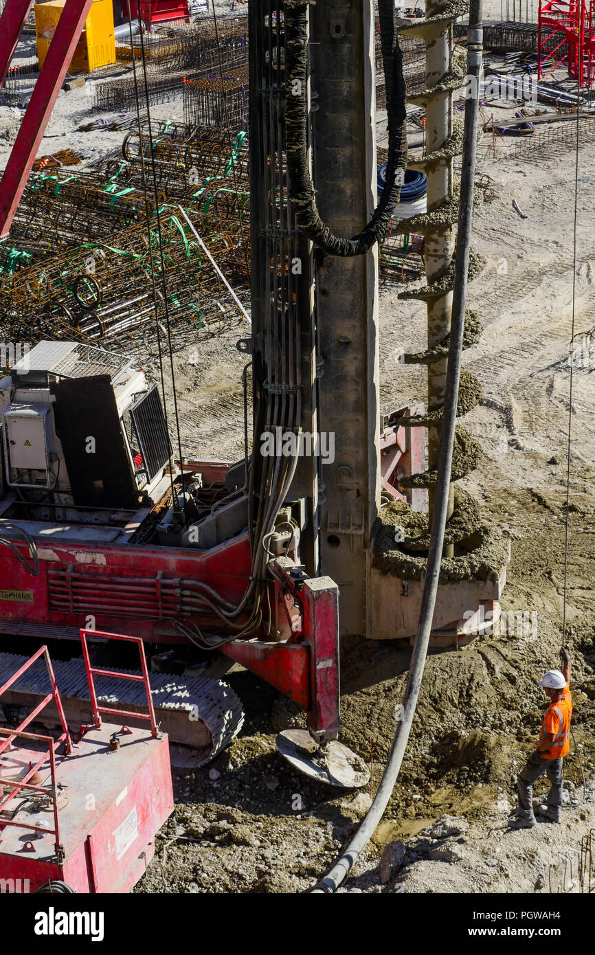 Global project of urban re-development: drilling machine at work on a ...