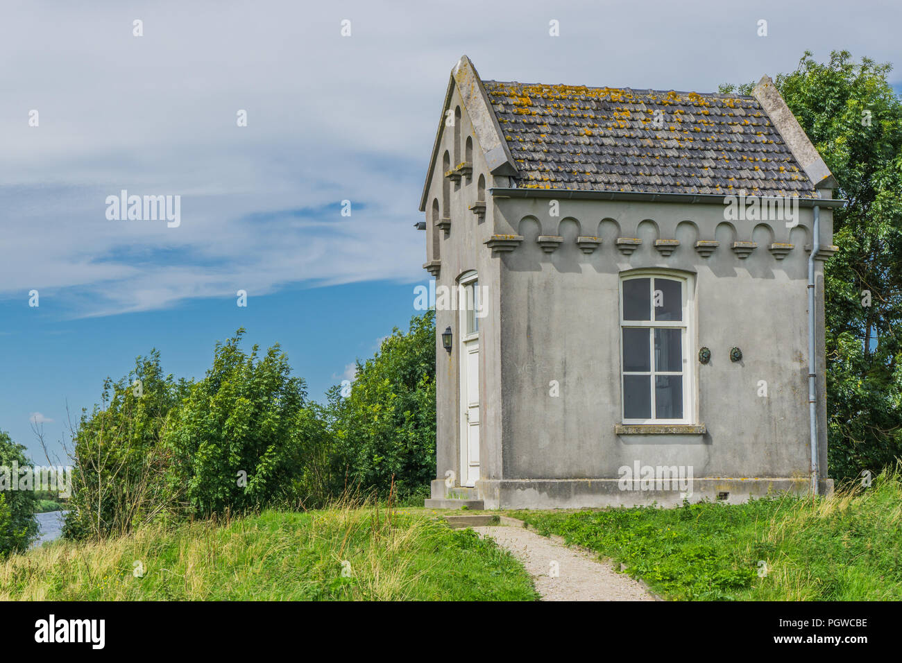 small cottage looking like a crypt in nature landscape Stock Photo - Alamy