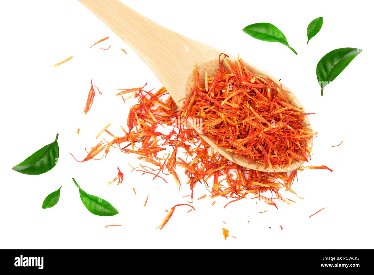 Heap of saffron in wooden spoon isolated on white background. Top view ...