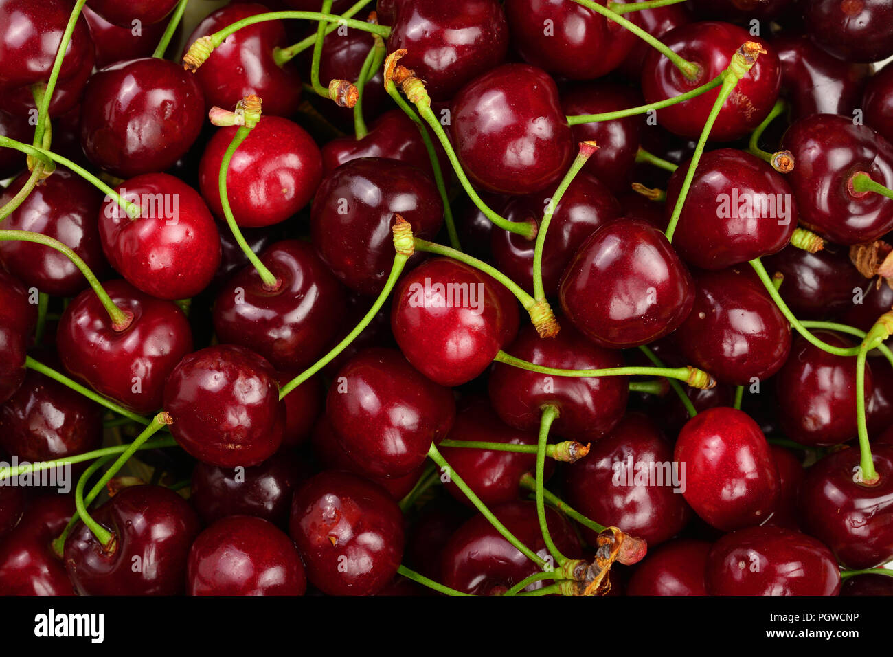 Fresh red cherries background texture hi-res stock photography and ...