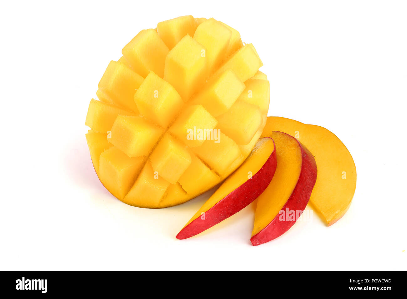 Mango fruit half with slices isolated on white background close-up ...