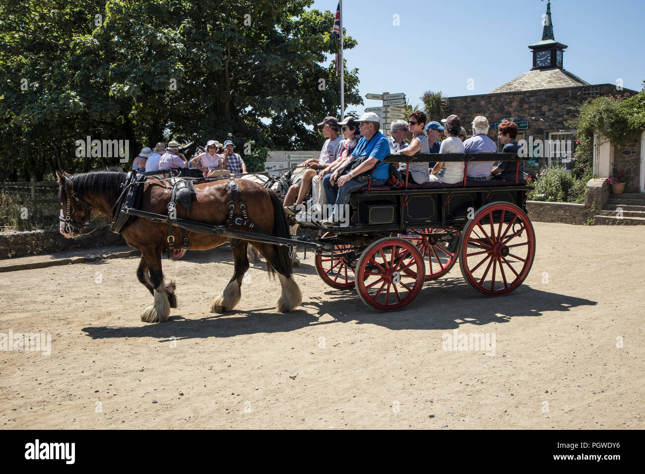 Setting off on a tour of the island on a Horse drawn tourist carriage ...