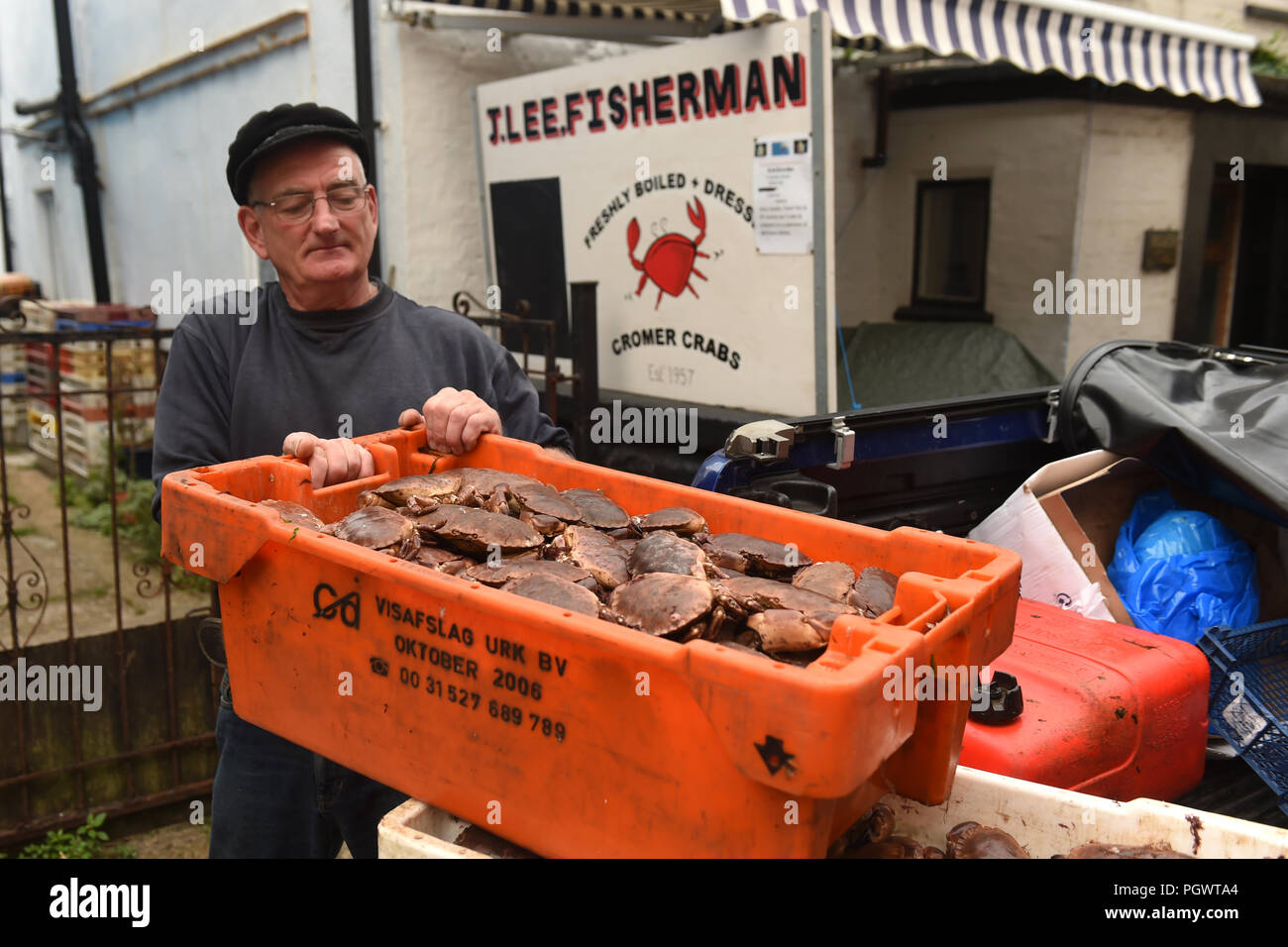 Crab fisherman John Lee returns to his shop with his haul of crab in ...