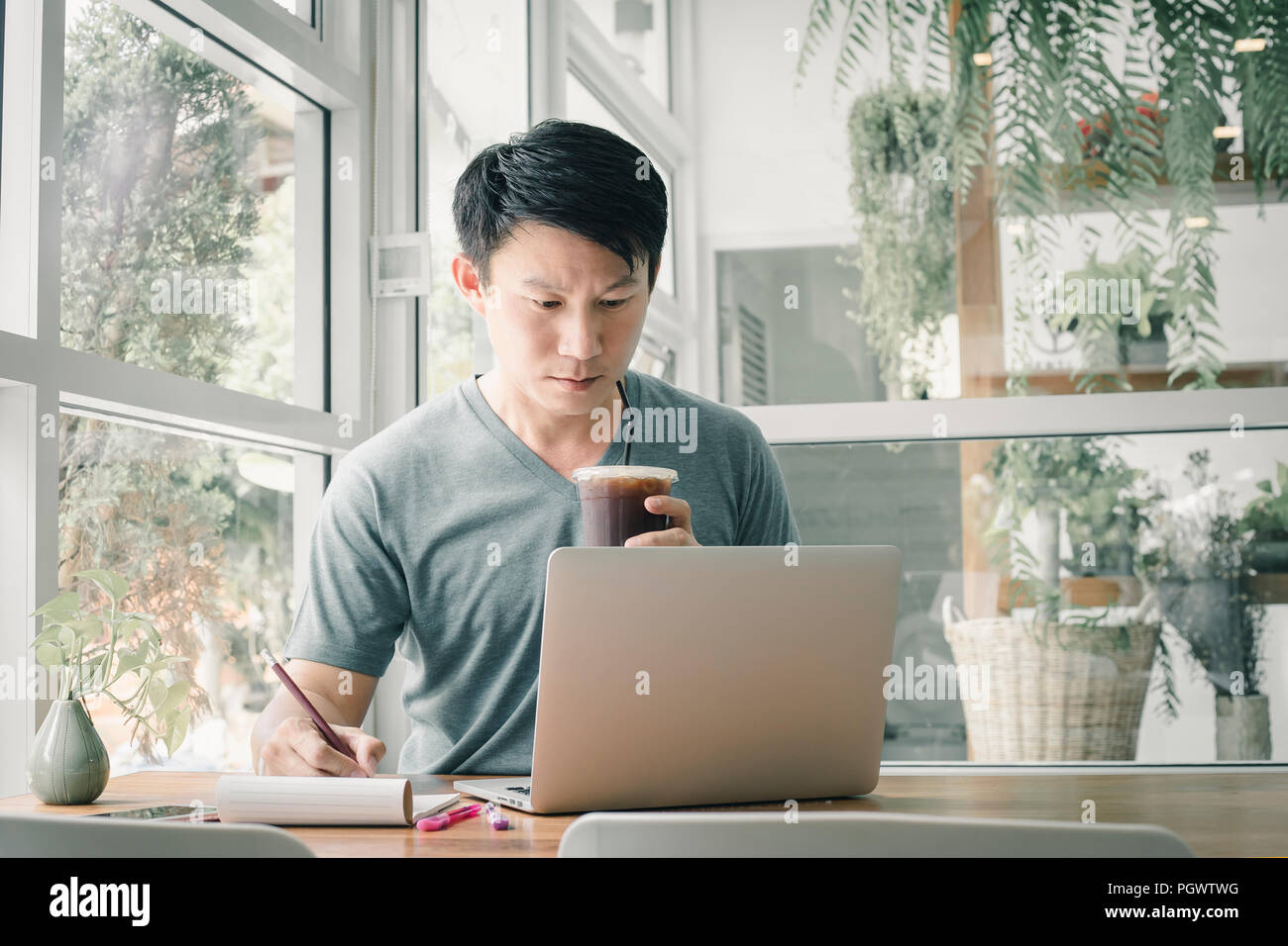 Freelancer man working online at his home Stock Photo - Alamy