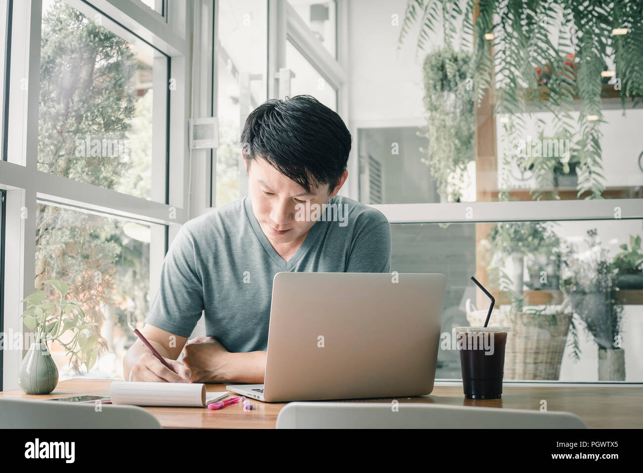 Freelancer man working online at his home Stock Photo - Alamy