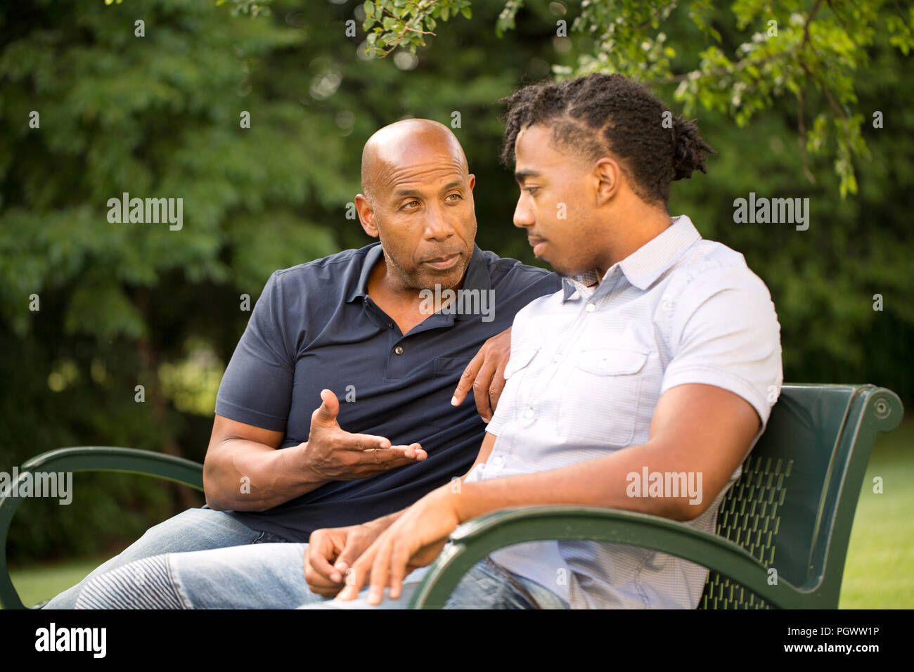 Mature man mentoring and giving advice to a younger man Stock Photo - Alamy