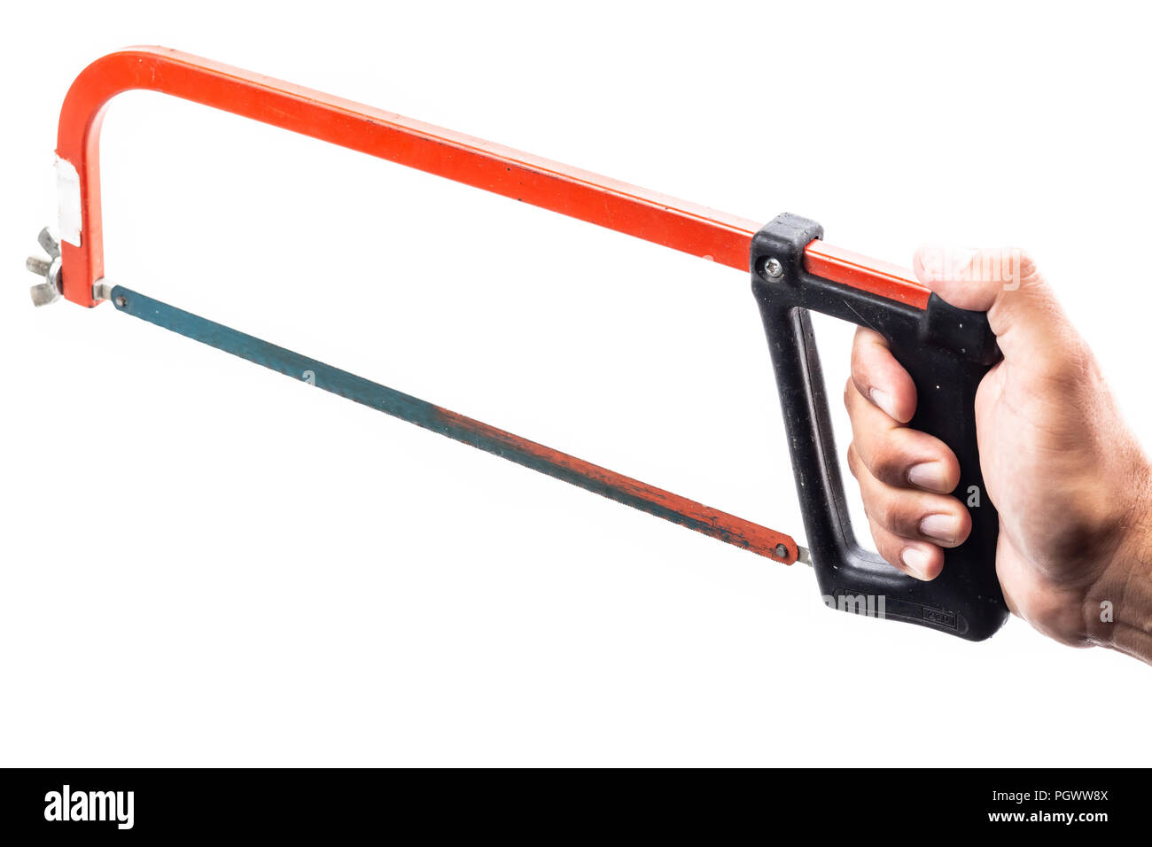 man who serves in his hand a rusty red hacksaw on a white background in ...