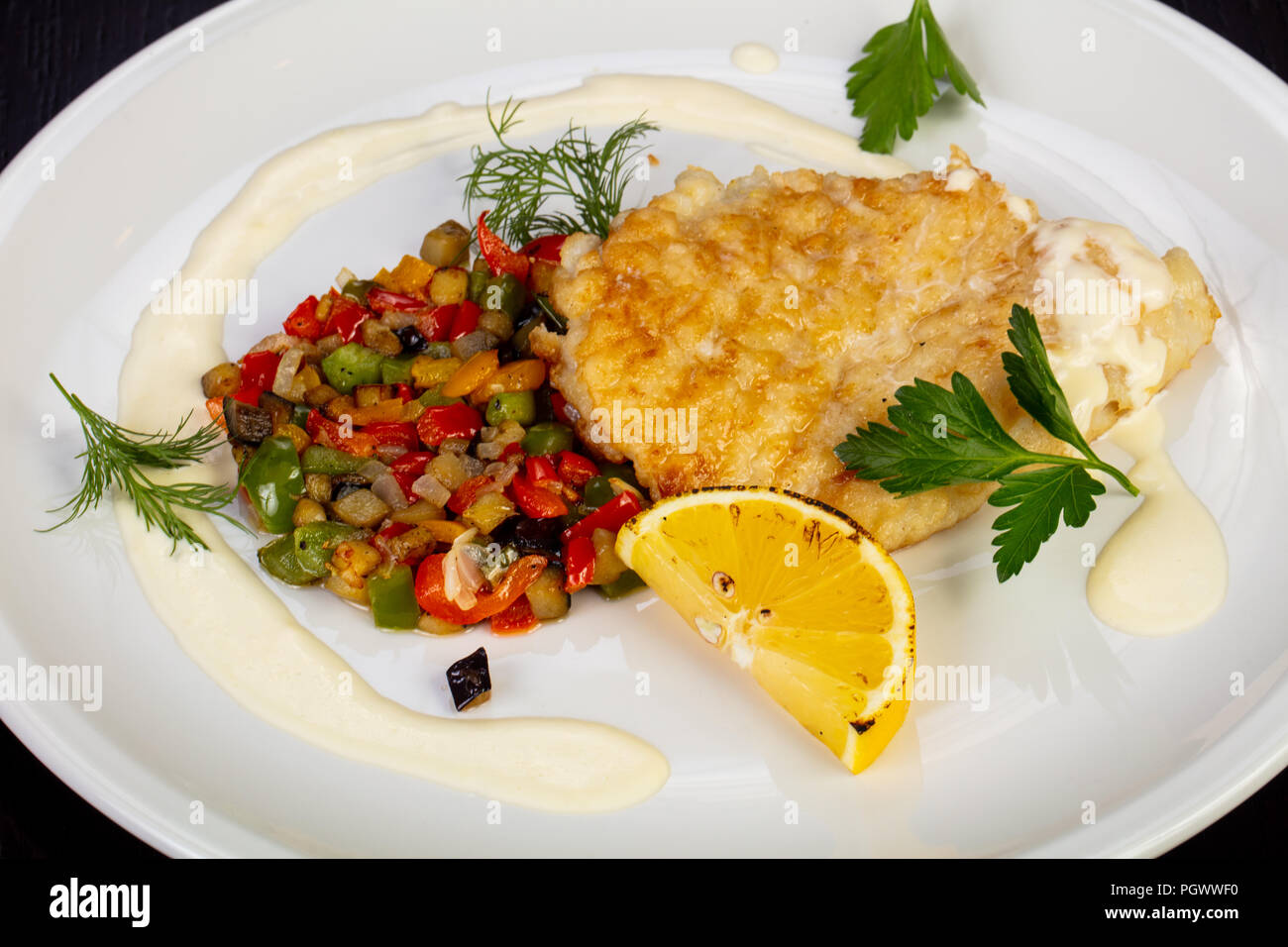 Tasty fried cod with lemon Stock Photo - Alamy