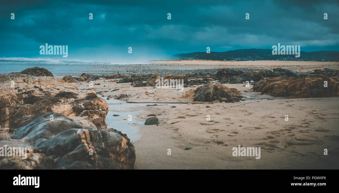 Beach sand and rocks in seascape Stock Photo - Alamy