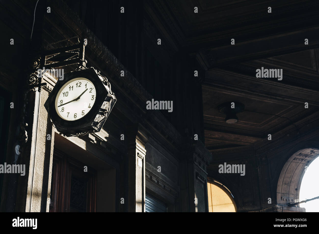 A large illuminated clock in the Street on city walk Stock Photo - Alamy