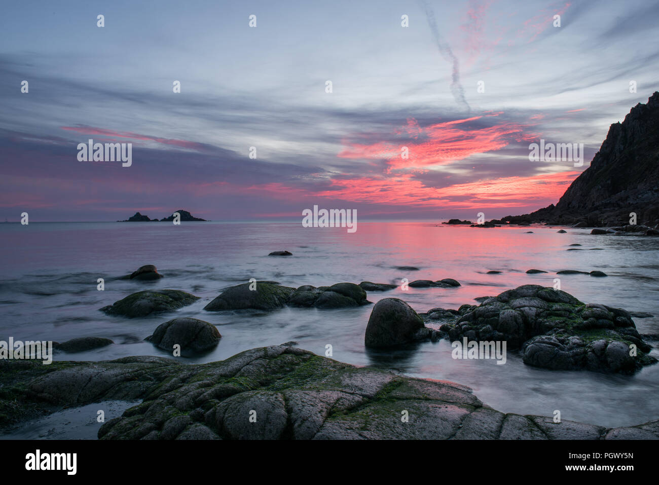 Sunset reflections at the beach Stock Photo - Alamy