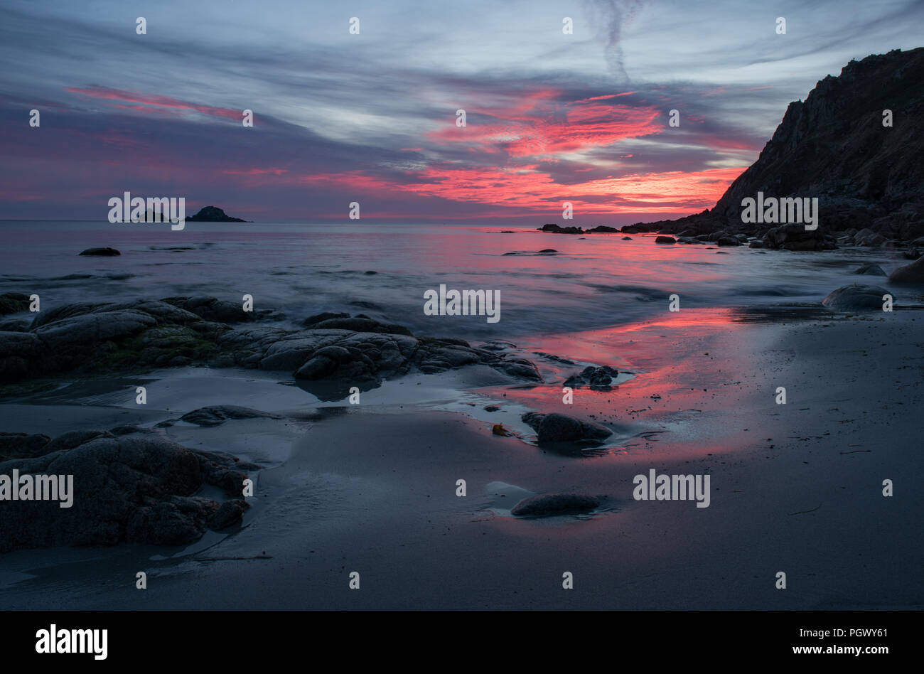 Sunset reflections at the beach Stock Photo - Alamy