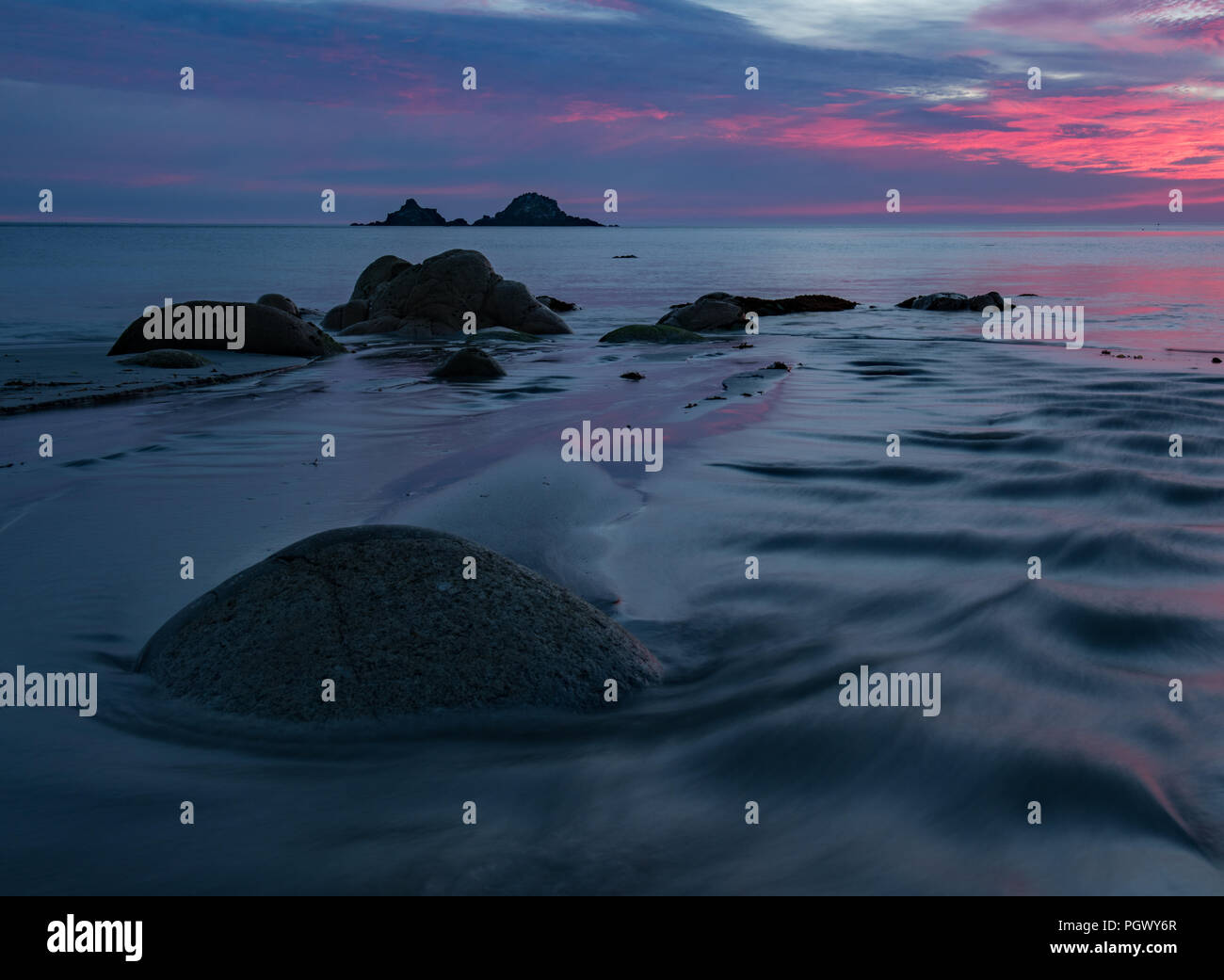 Sunset reflections at the beach Stock Photo - Alamy