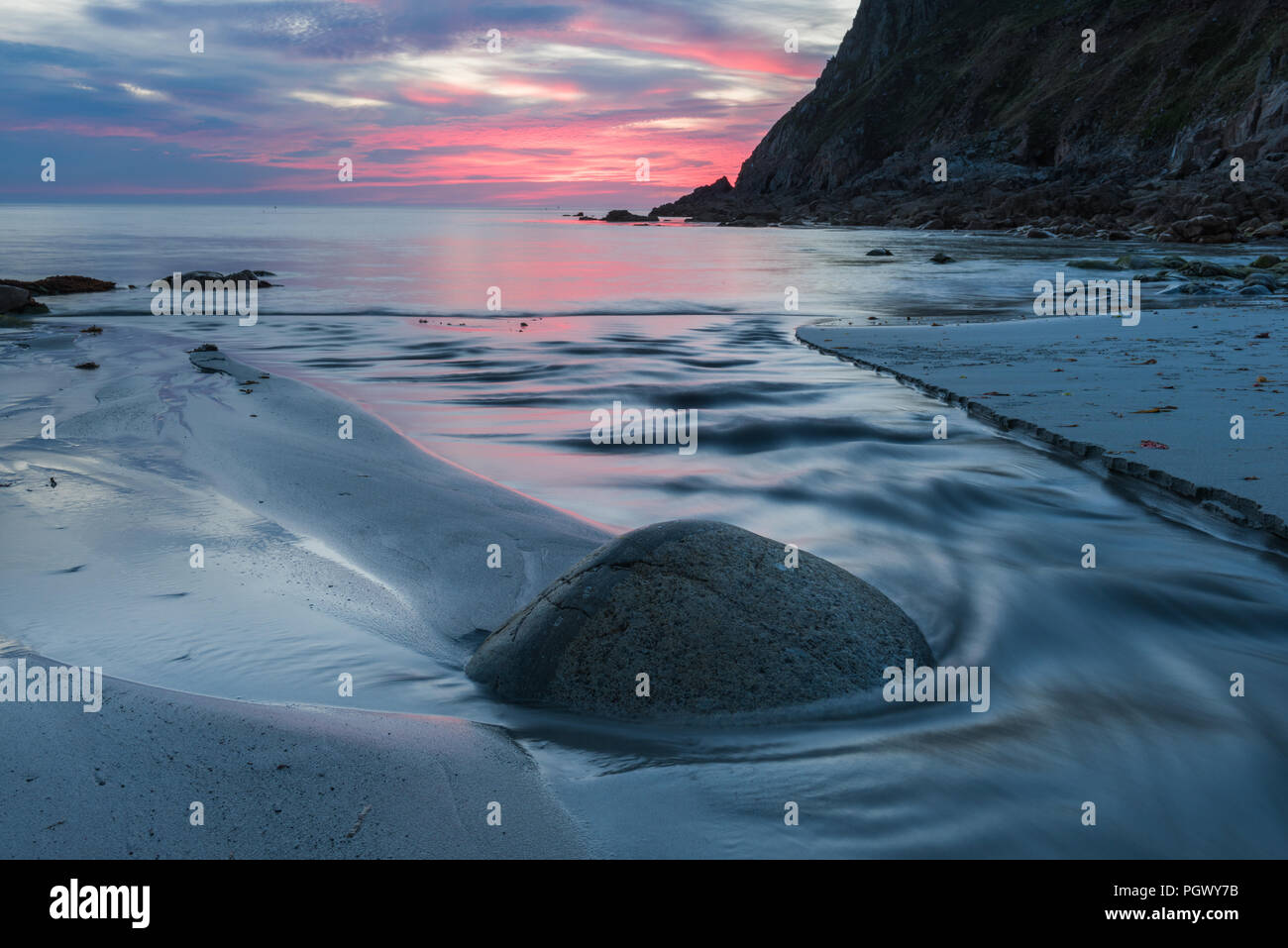 Sunset reflections at the beach Stock Photo - Alamy
