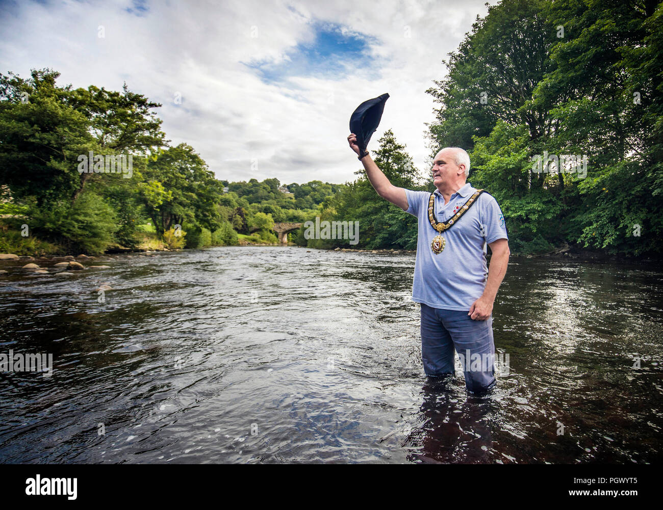 Mayor of Richmond Jonathan Preece stands in the River Swale as he marks ...