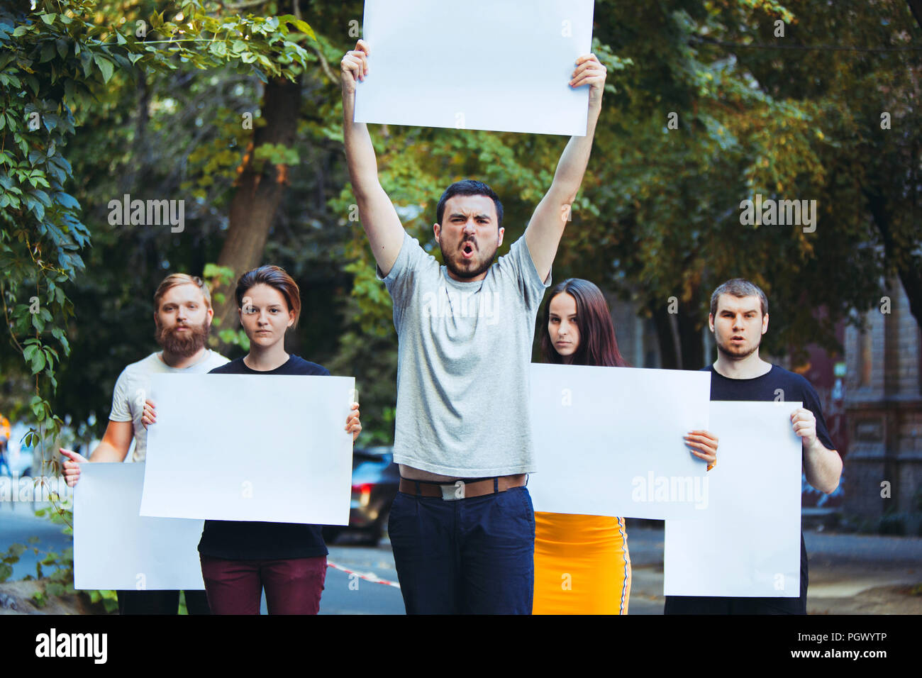 Group of protesting young people outdoors. The protest, people ...