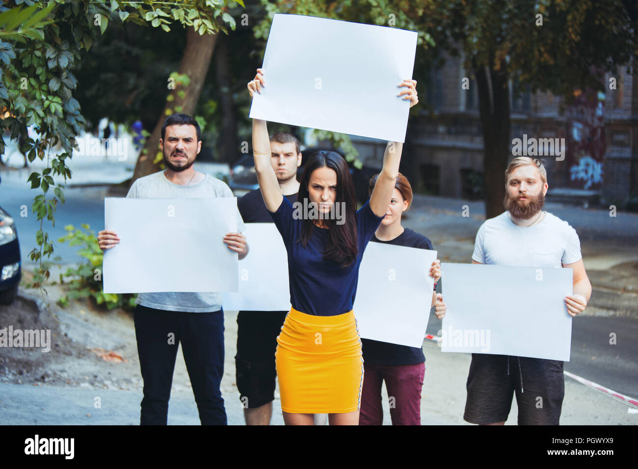 Group of protesting young people outdoors. The protest, people ...