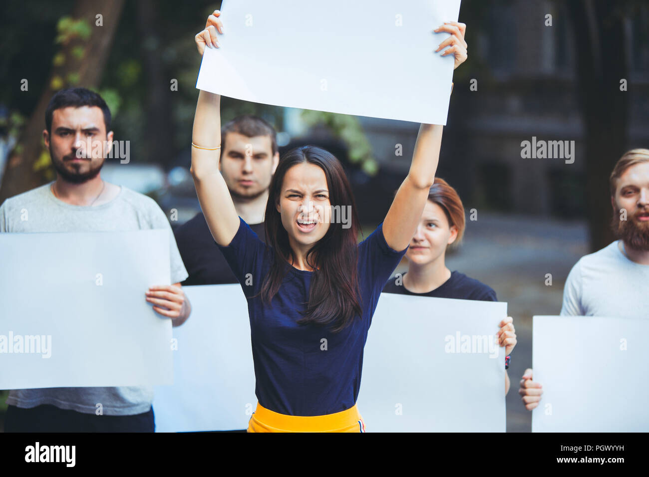 Group of protesting young people outdoors. The protest, people ...
