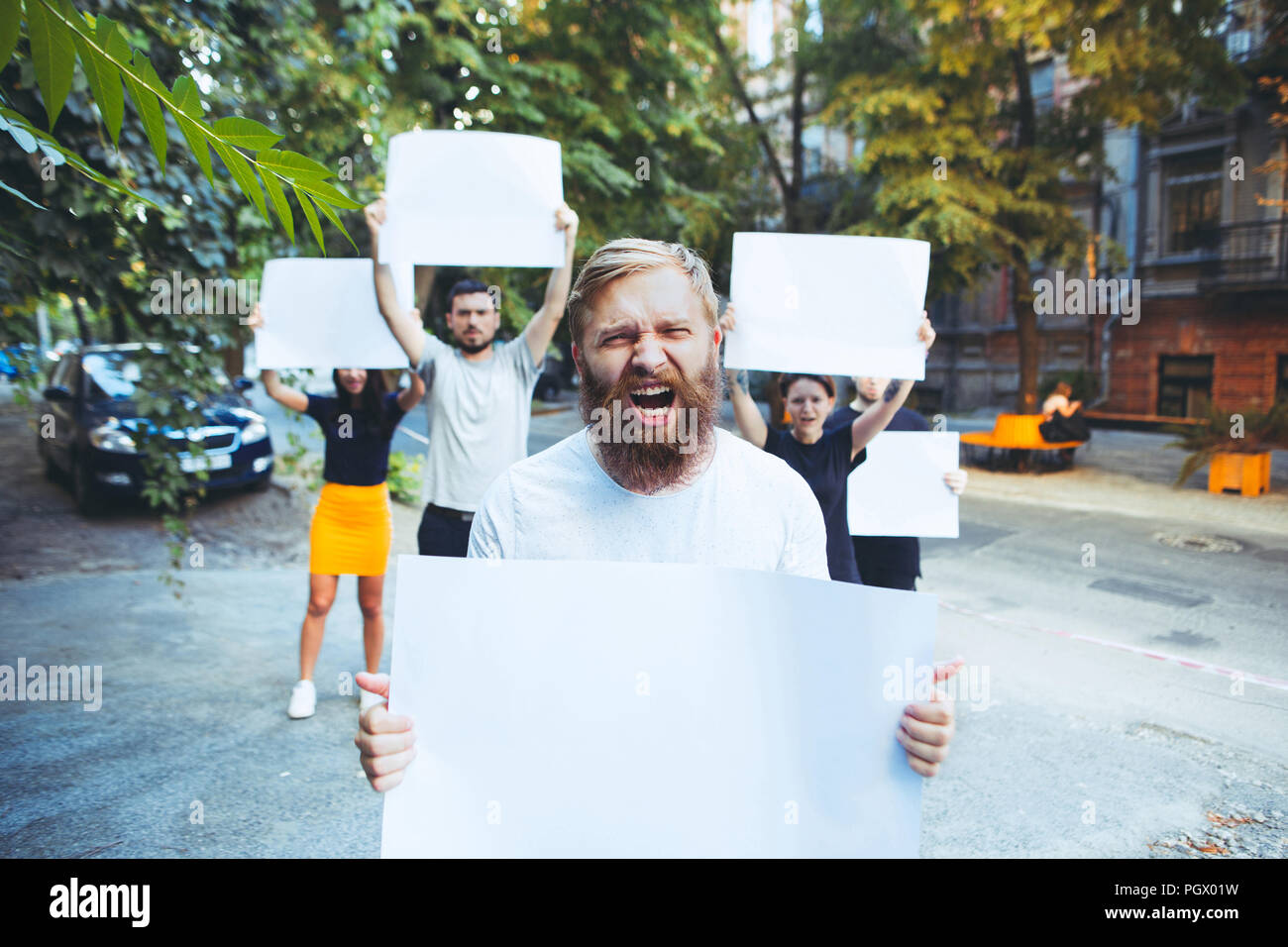 Group of protesting young people outdoors. The protest, people ...