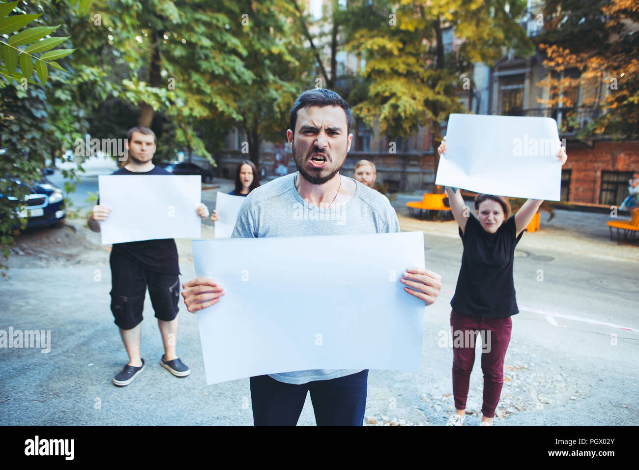 Group of protesting young people outdoors. The protest, people ...