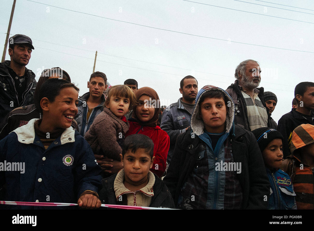 People waiting the distribution of humanitarian aid, mainly drinking ...