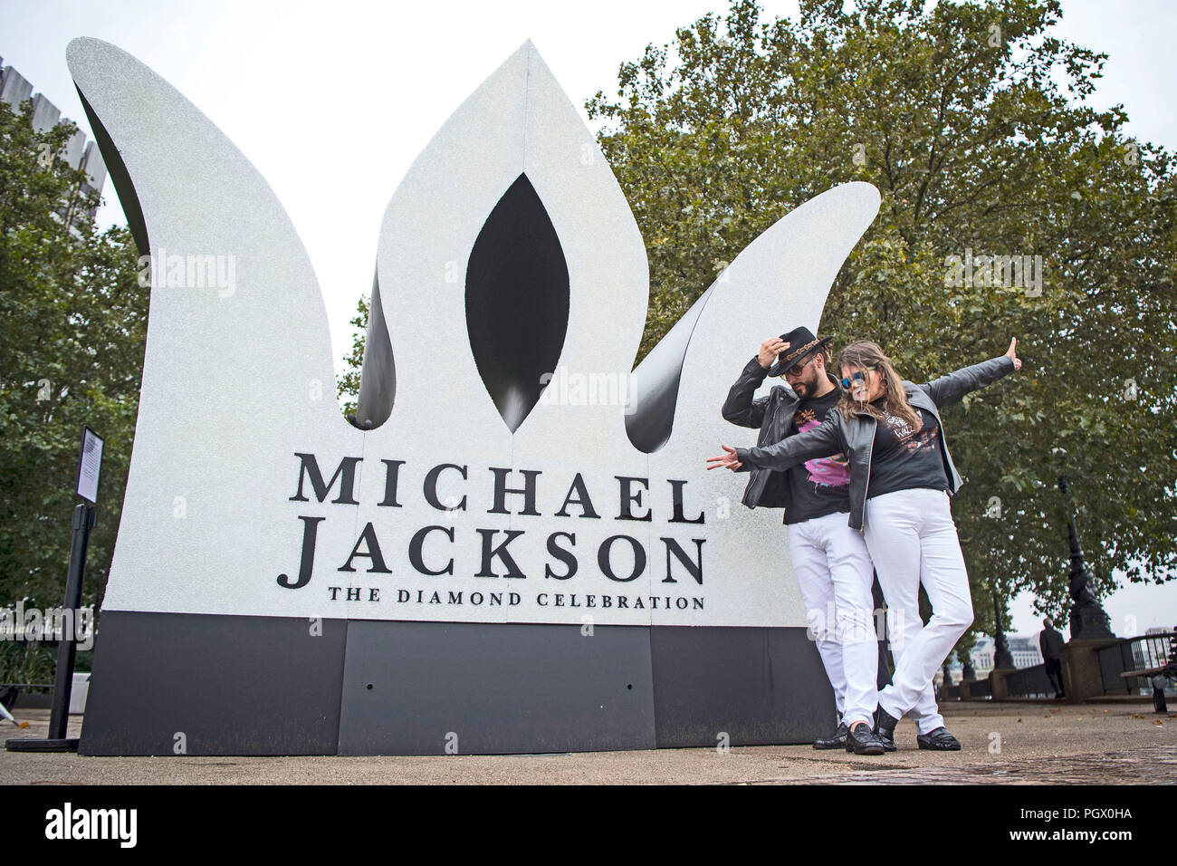 Michael Jackson fans Graham Summers and Henrietta Cowell pose with a ...