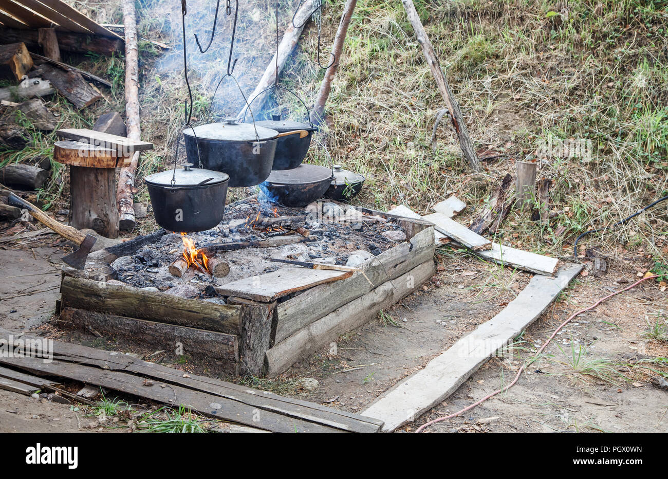 Old pot cooking over campfire hi-res stock photography and images - Alamy